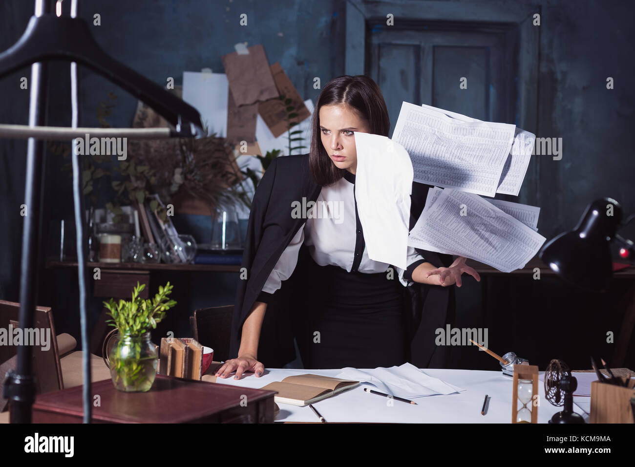 Young business woman throwing documents at camera Stock Photo - Alamy