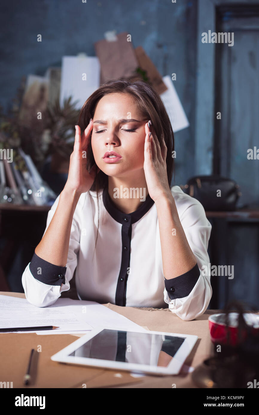 Young frustrated woman working at office desk in front of laptop Stock ...