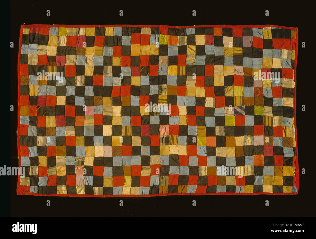 Doll Quilt In Small Block Pattern Stock Photo - Alamy