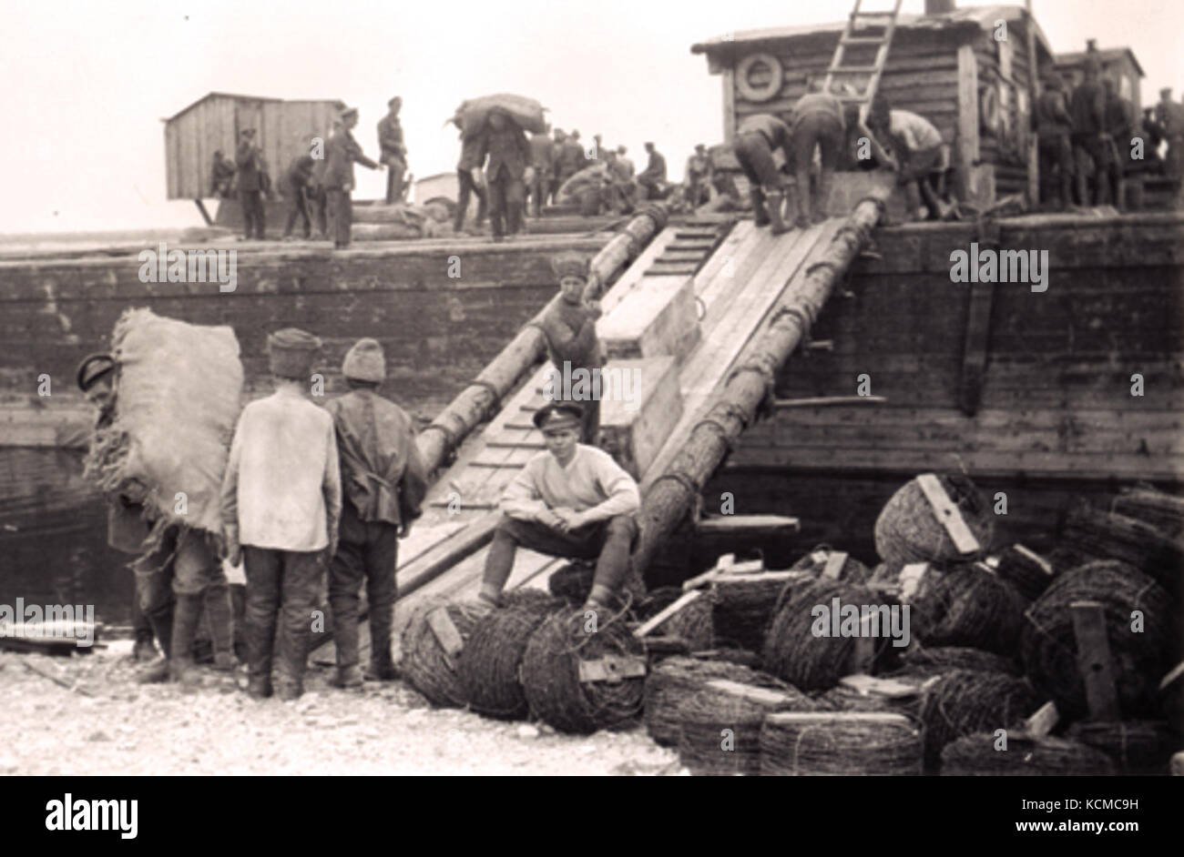 Canadian Gunner Supervises Prisoners Loading a Barge in Yemetskoe in ...