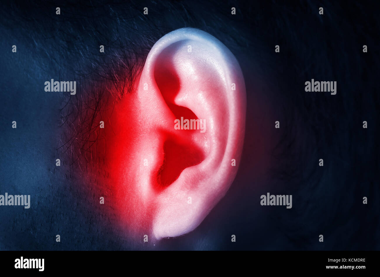human male ear on a dark background isolated Stock Photo - Alamy