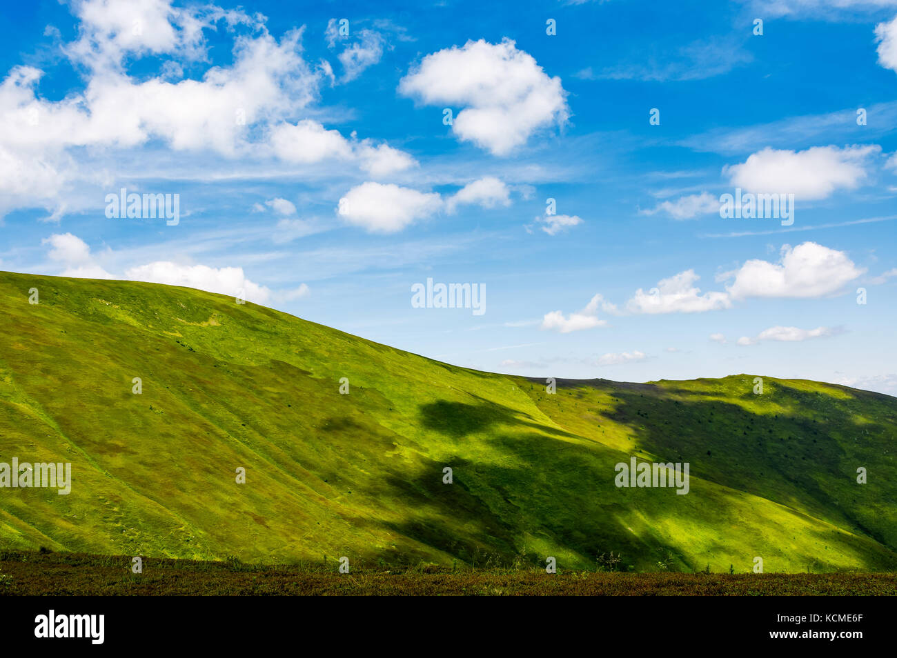 green alps under blue sky. gorgeous mountainous landscape with fresh ...