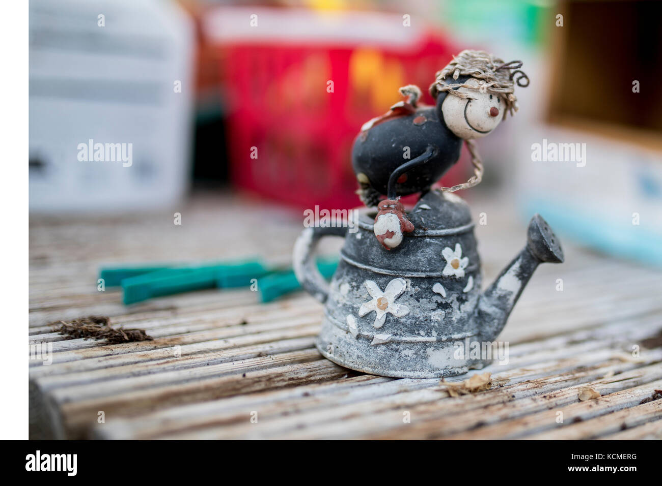 Quirky ornamental character riding on a rustic flower decorated ...