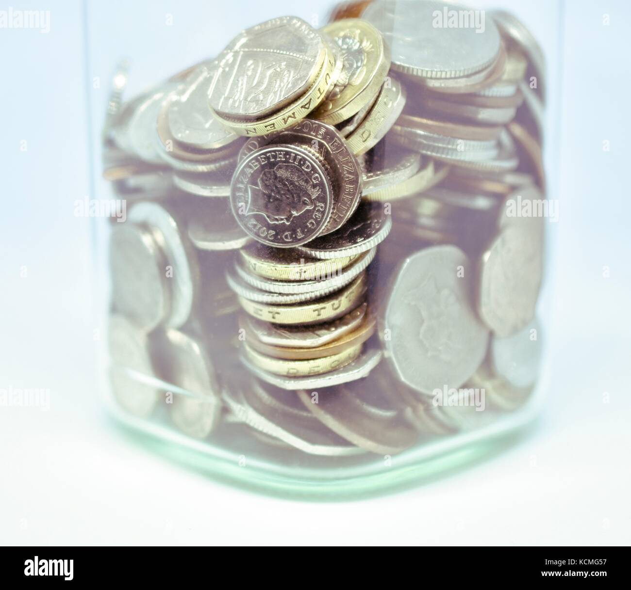 Close up Study of Coins Saved in Glass Jar Stock Photo - Alamy