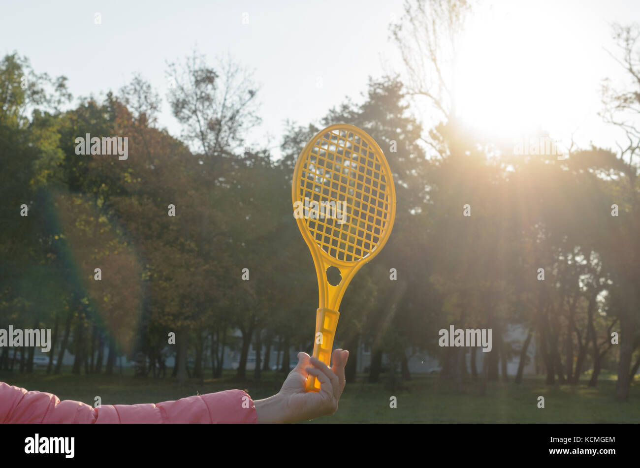 A tennis racket in his hand catches the ball in motion Stock Photo - Alamy
