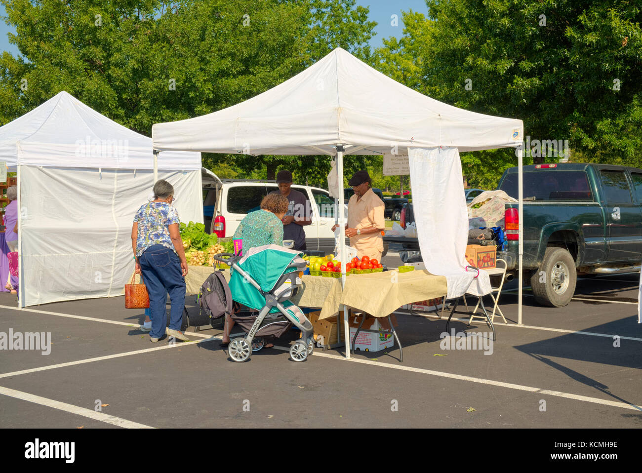 Small farmer's market with vendors selling fresh fruits and vegetables ...