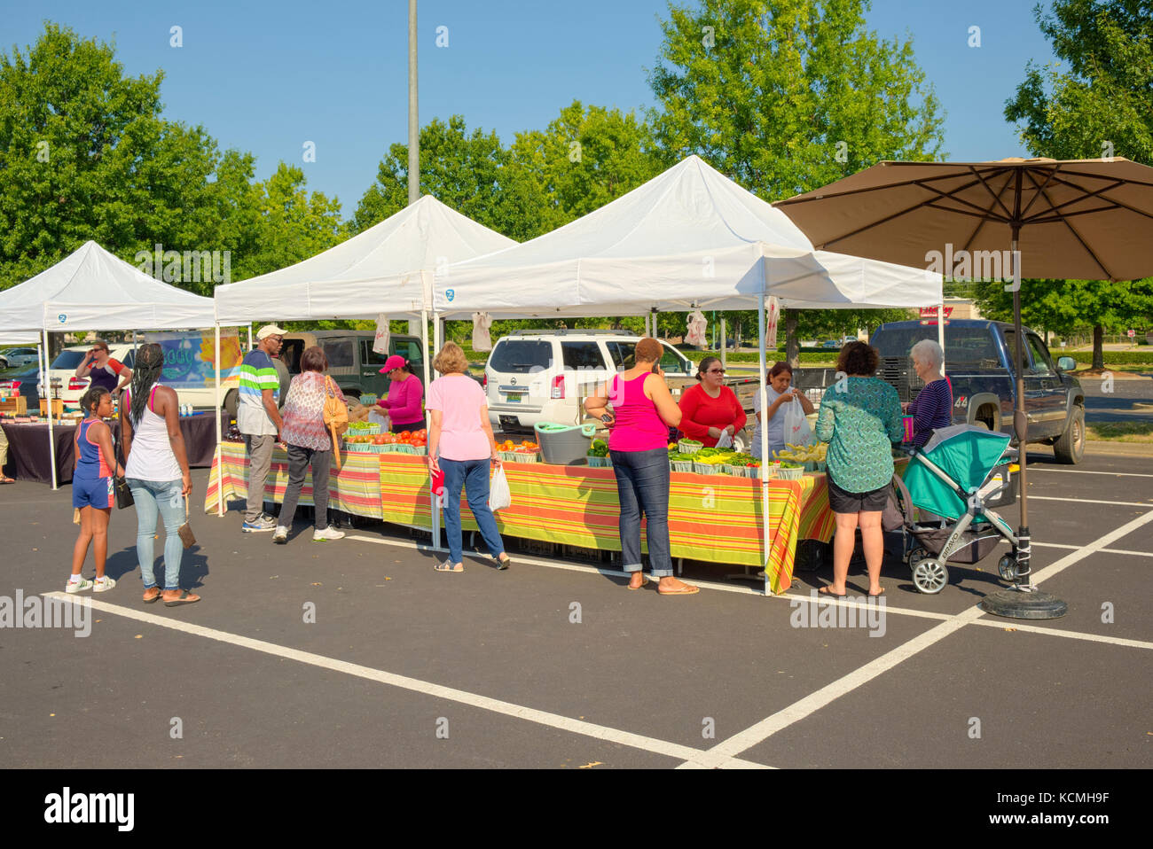 Small farmer's market with vendors selling fresh fruits and vegetables ...