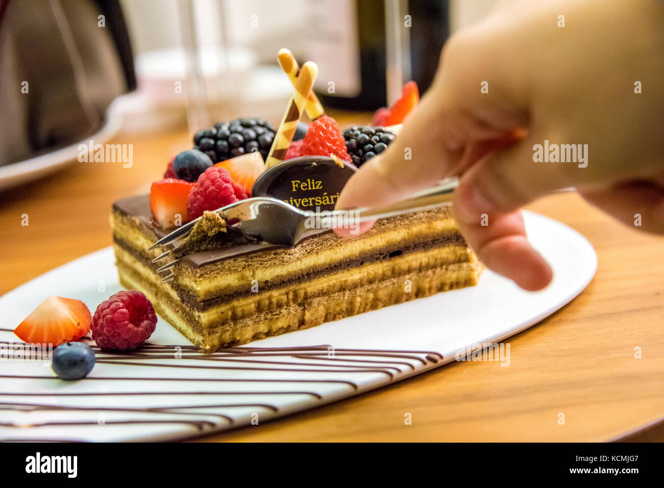 woman eating birthday cake Stock Photo - Alamy