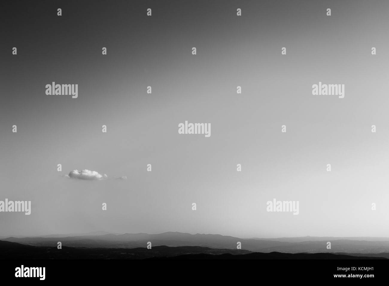 An isolated, little white cloud in an empty sky Stock Photo - Alamy