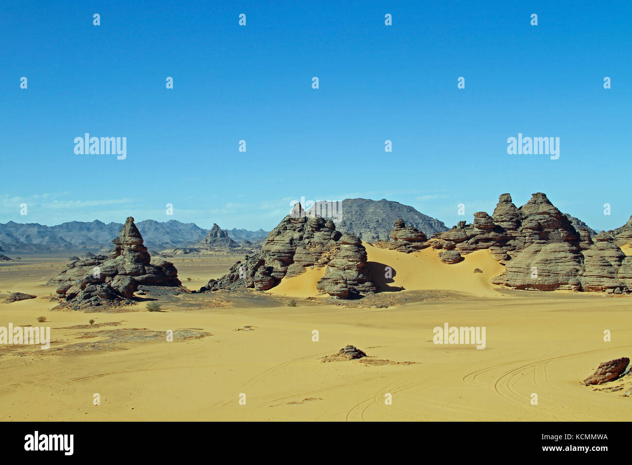 Rock formations and sand dunes in barren landscape, Sahara Desert ...