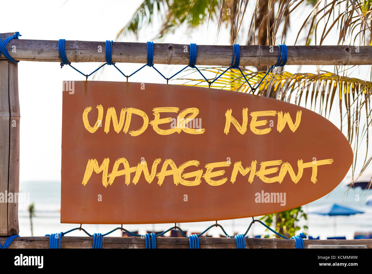 Orange vintage signboard in shape of surfboard with Under New ...