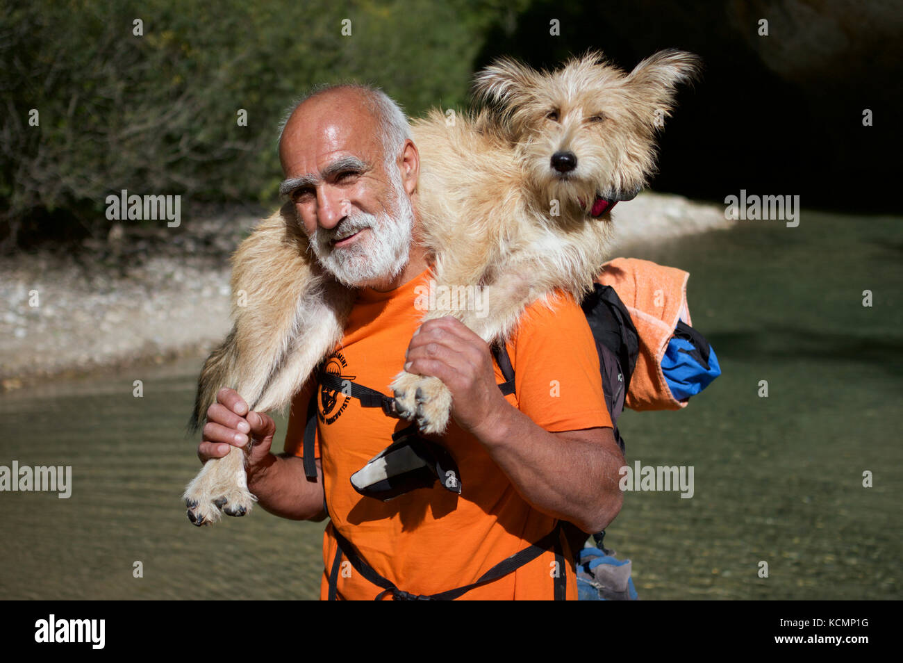 A man carrying his dog, guara natural park, Huesca, Spain Stock Photo ...