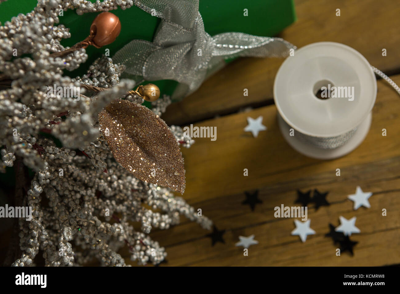 Overhead view of thread spool by wreath on table Stock Photo - Alamy