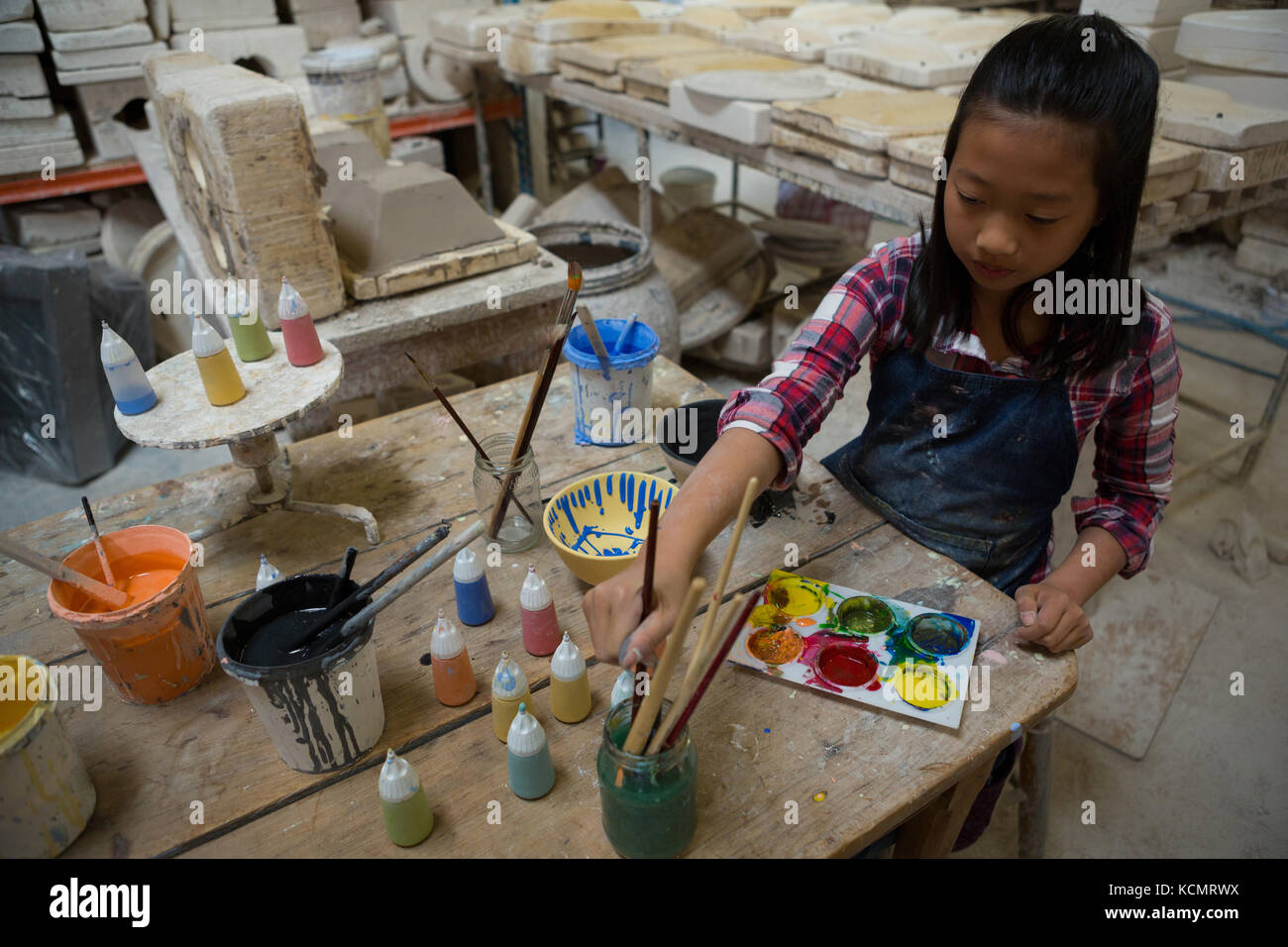Painting pottery girl decorating bowl hi-res stock photography and ...