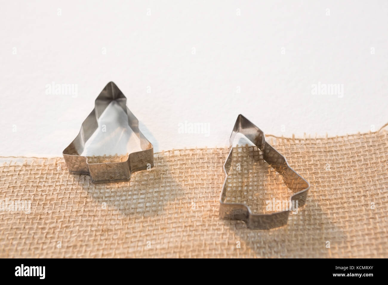 Close-up of cookie cutters on textile against white background Stock ...