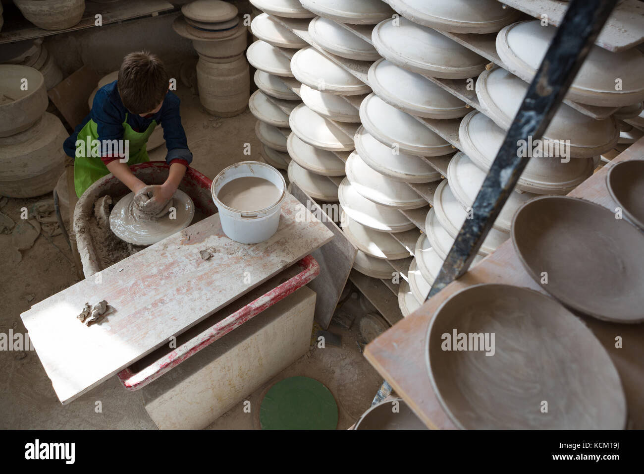 Boy making a pot in pottery workshop Stock Photo - Alamy