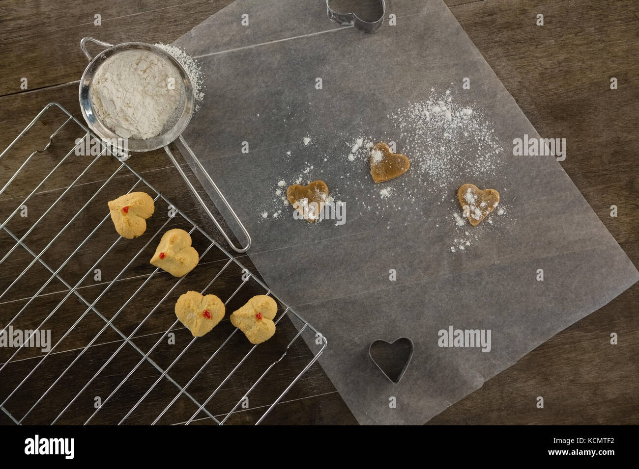 Close-up of sieve with icing sugar cookies on cooling rack Stock Photo ...