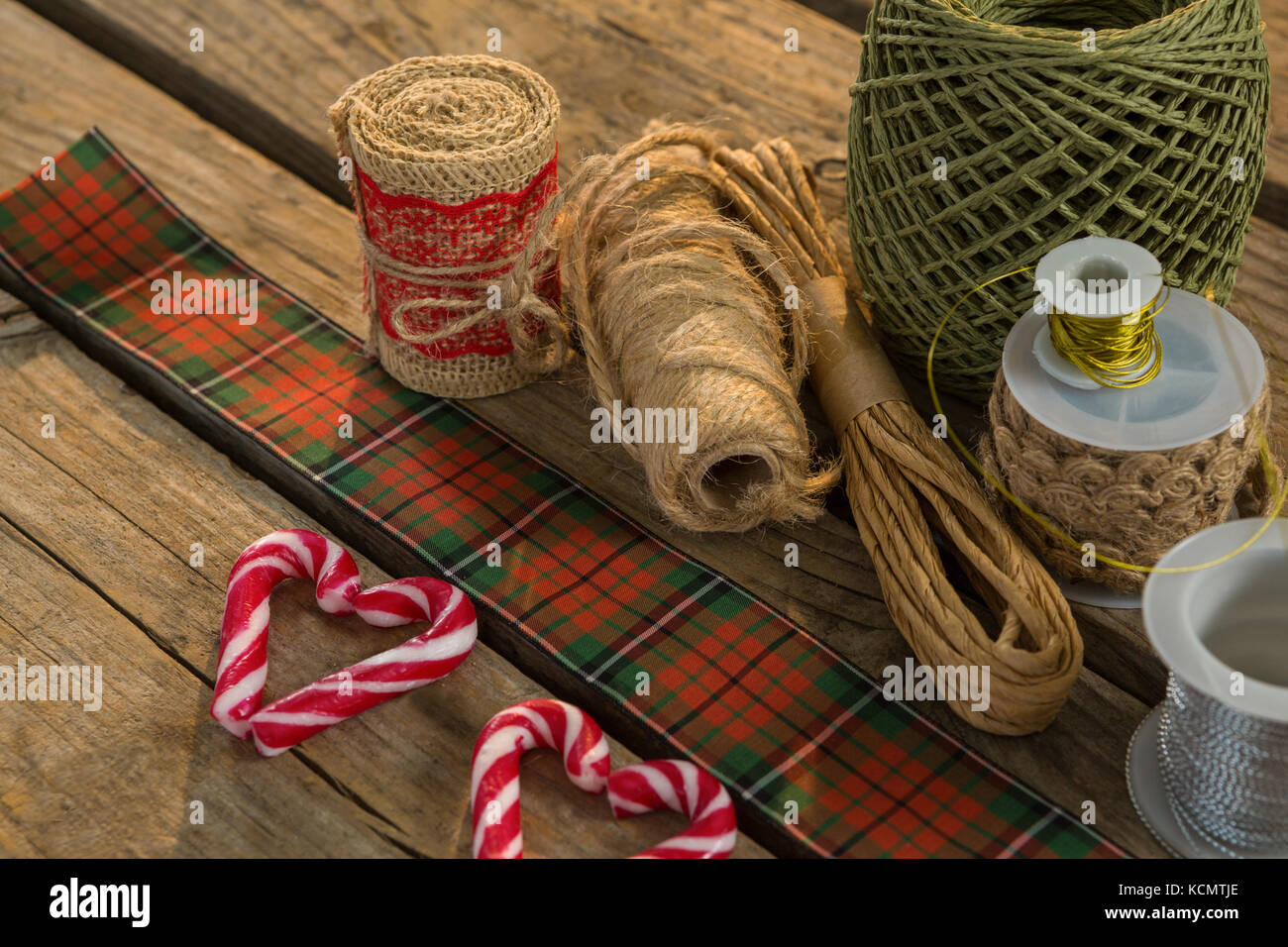 High angle view of thread spools with candy cane on table Stock Photo ...