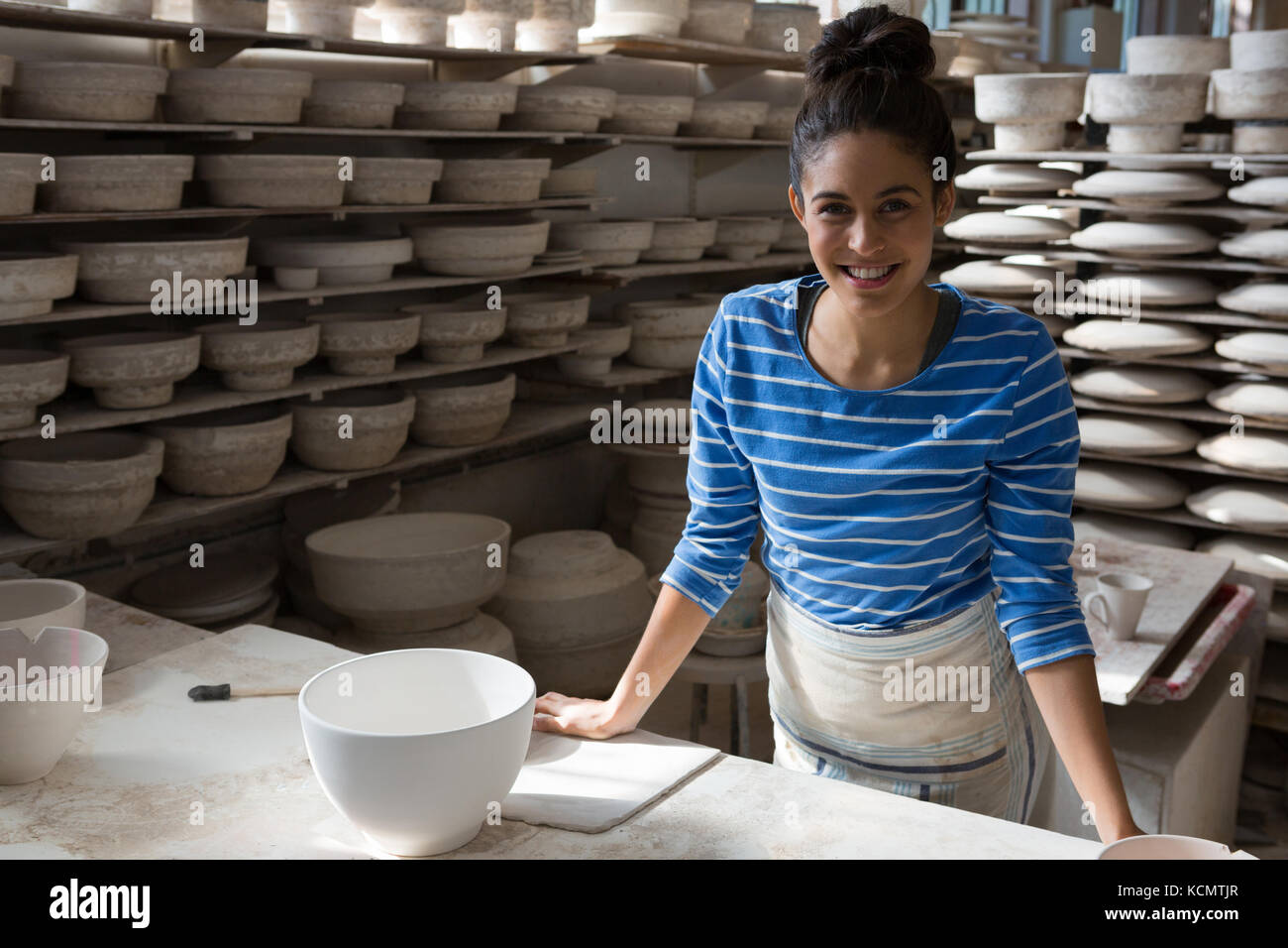 Portrait of female potter smiling in pottery workshop Stock Photo - Alamy