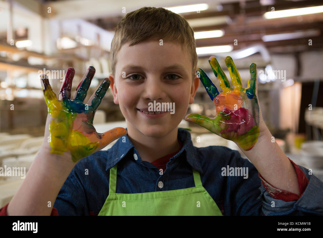 Boy showing paintbrush paint hi-res stock photography and images - Alamy