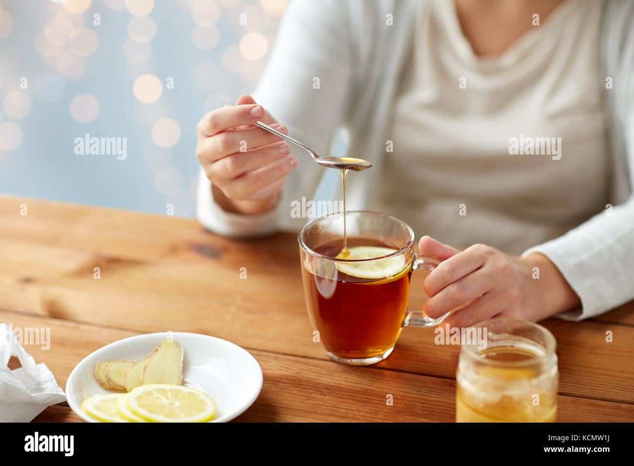 close up of ill woman drinking tea with lemon Stock Photo - Alamy