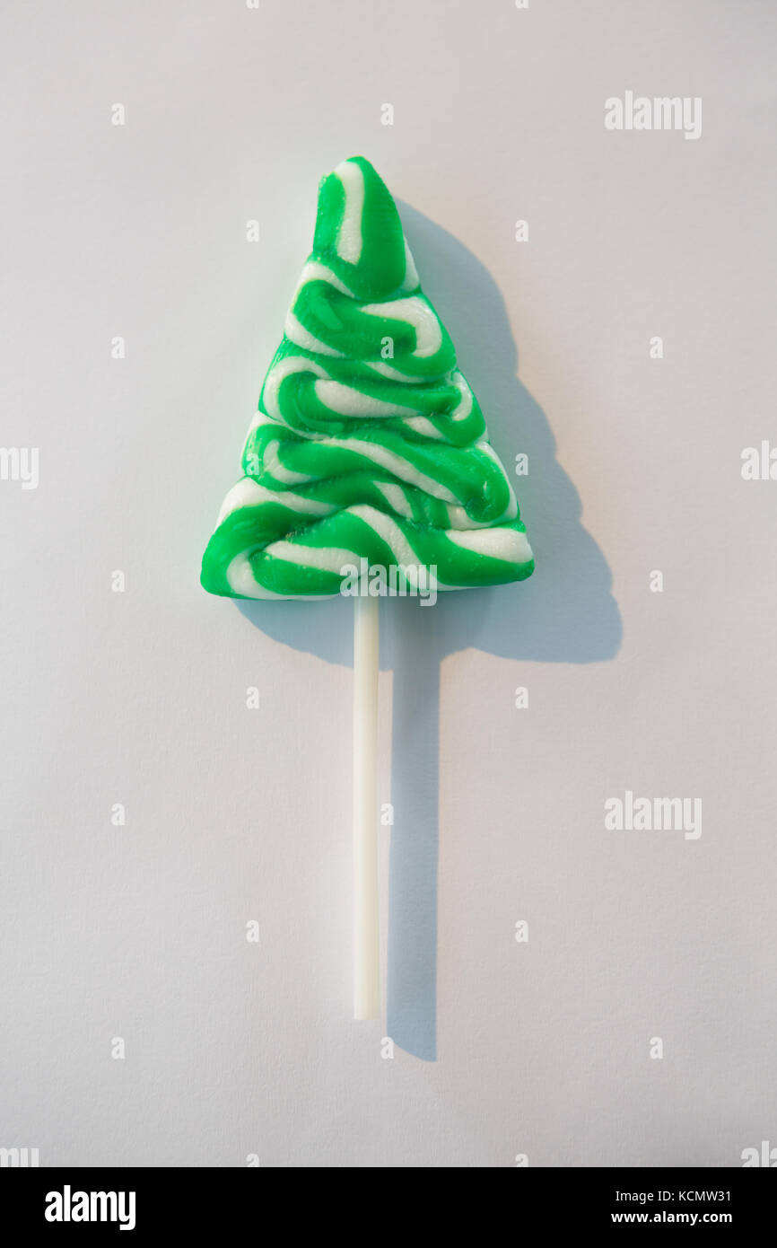 Close-up of christmas tree lollipop on white background Stock Photo - Alamy
