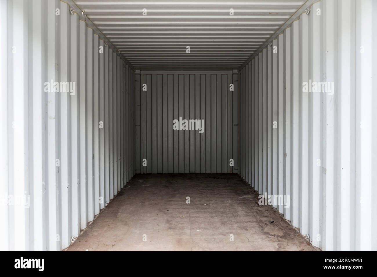 Perspective of the interior of a white cargo container Stock Photo - Alamy