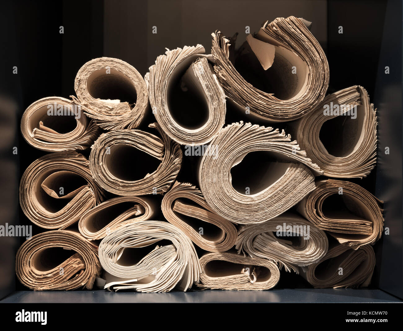 Rolls of old yellowed books and papers Stock Photo - Alamy
