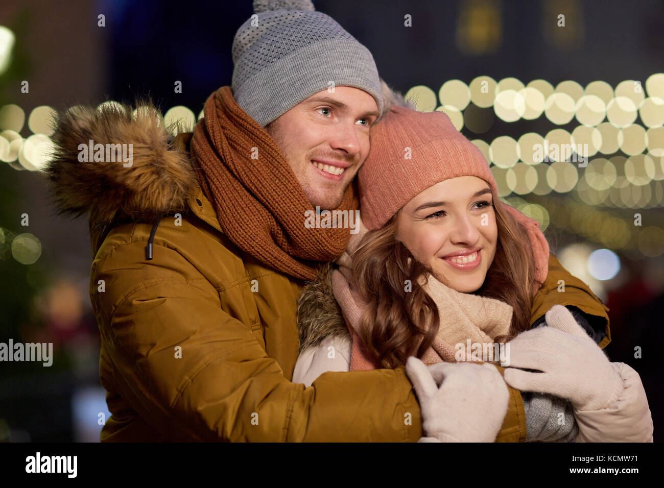 happy couple hugging at christmas tree Stock Photo - Alamy