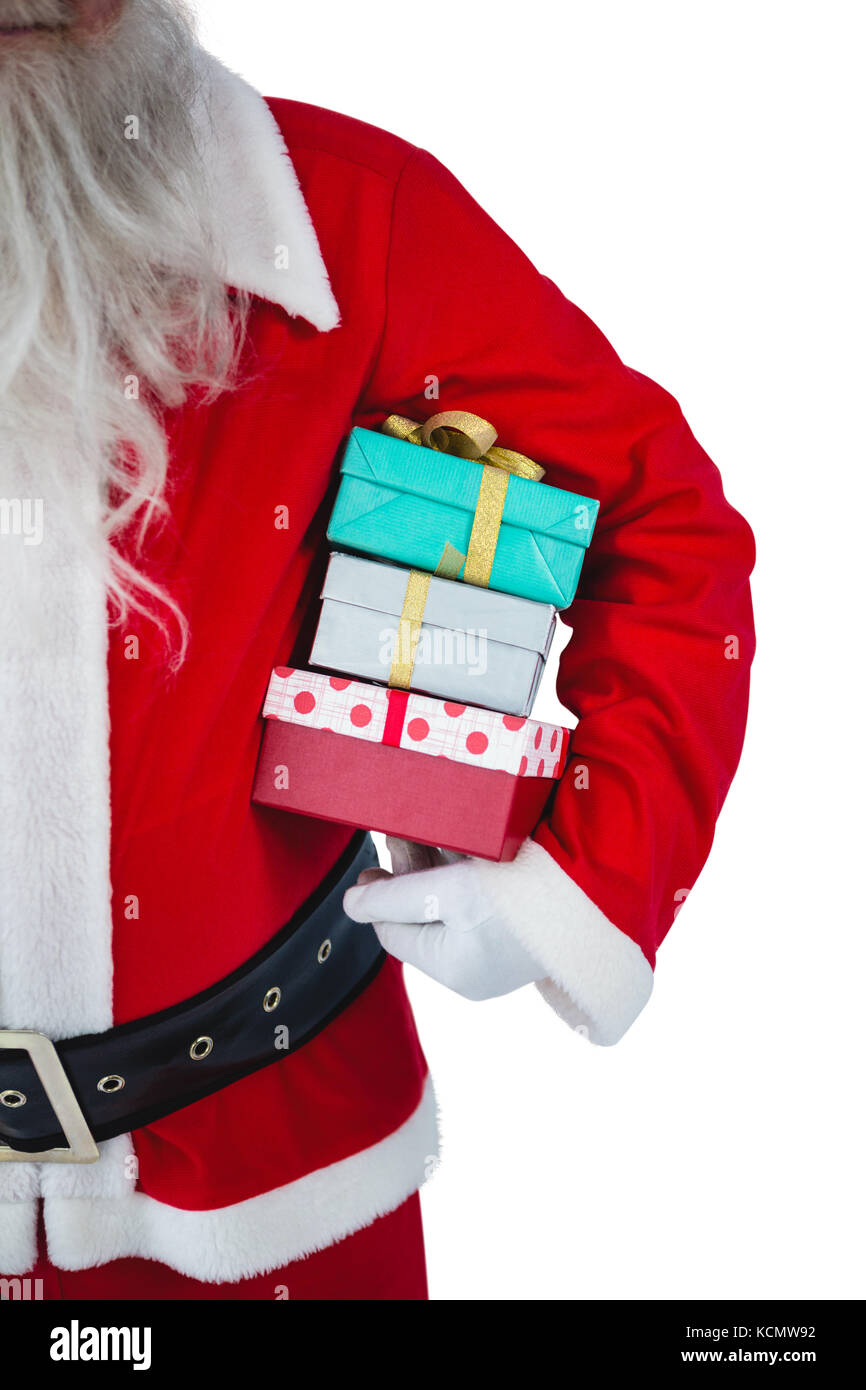 Santa Claus holding gift boxes against white background Stock Photo - Alamy