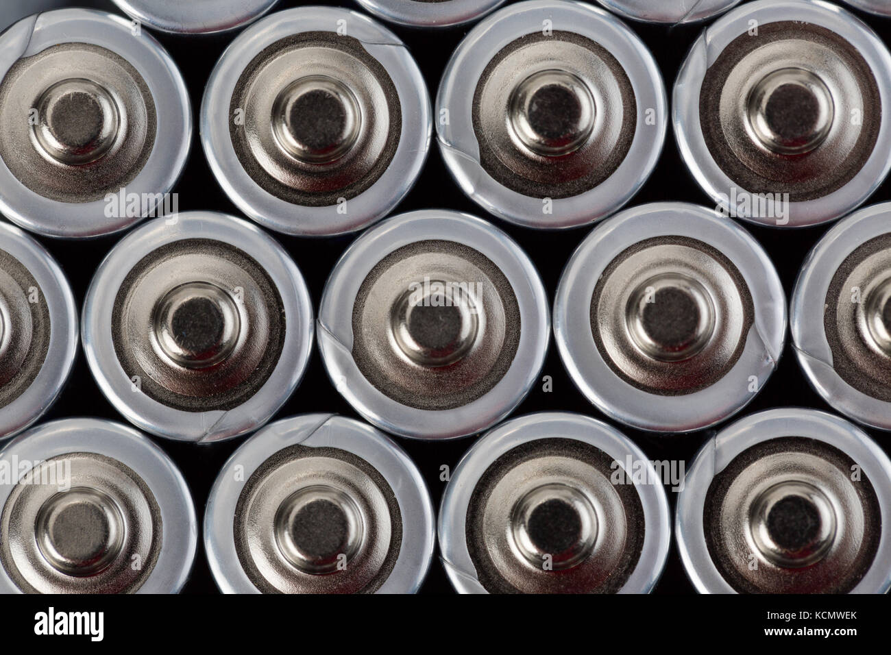 Close up top view on blurred rows of AA batteries energy abstract ...