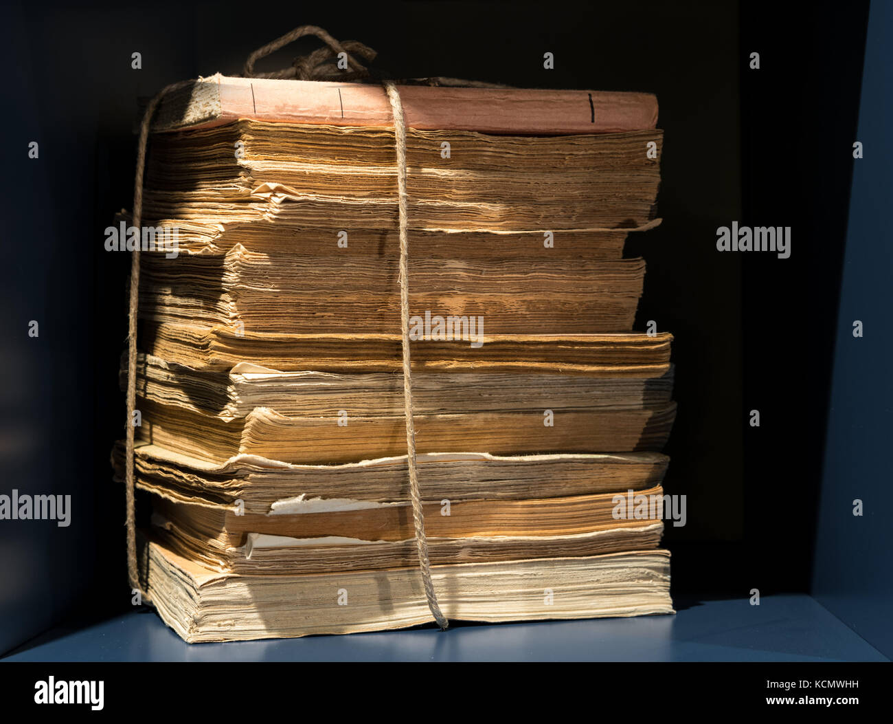 Stack of old yellowed books and papers Stock Photo - Alamy