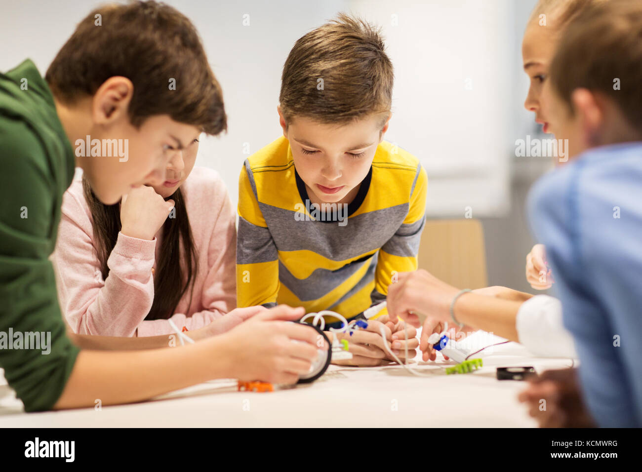 happy children building robots at robotics school Stock Photo - Alamy