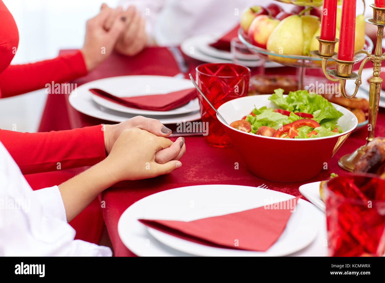 family having holiday dinner and praying at home Stock Photo - Alamy