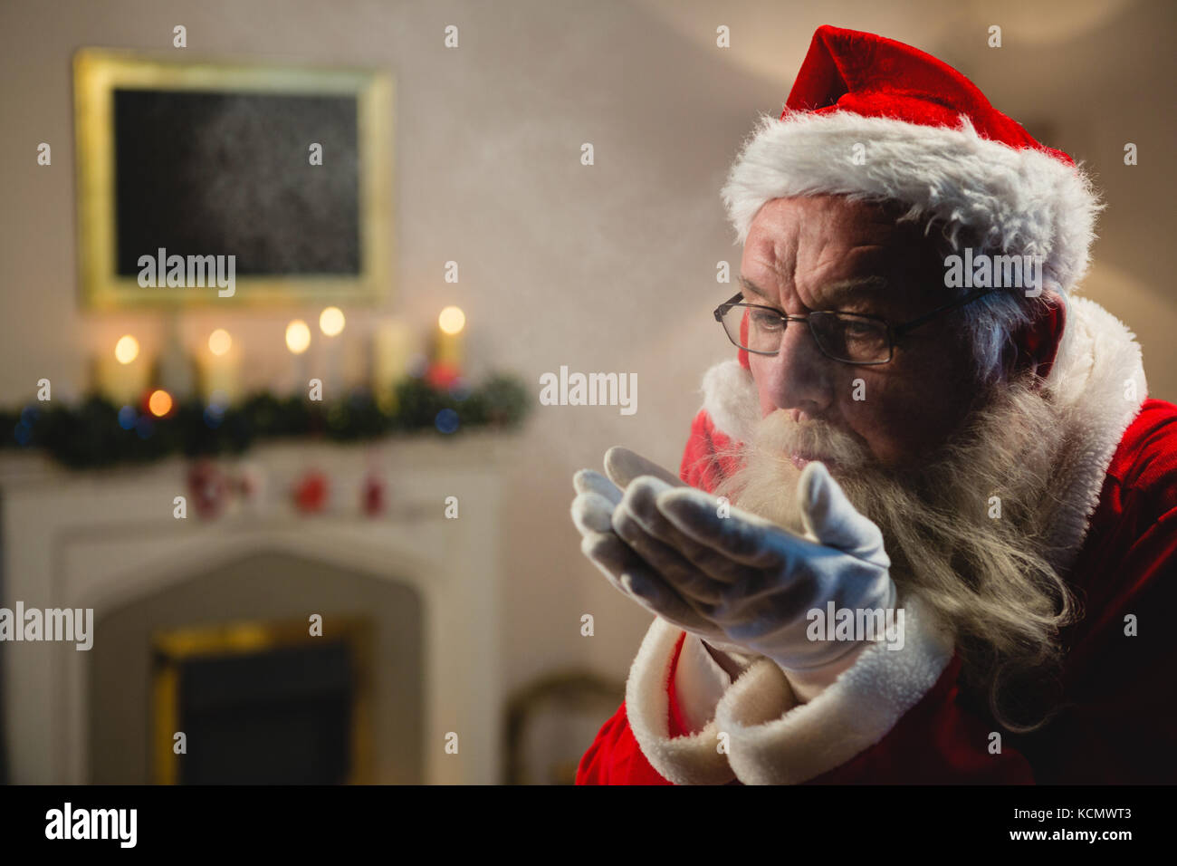Santa Claus blowing kiss at home Stock Photo - Alamy