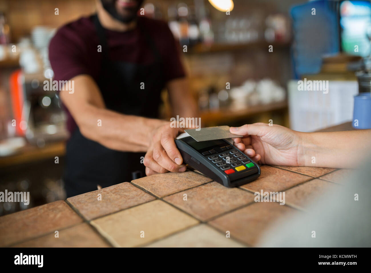 hands with payment terminal and credit card Stock Photo - Alamy