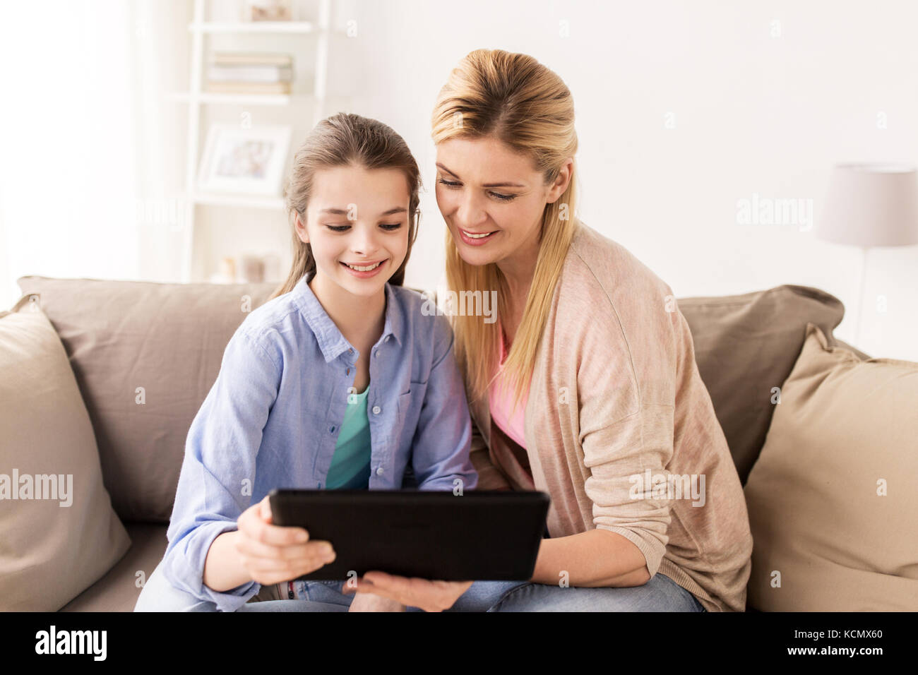happy family with tablet pc at home Stock Photo - Alamy