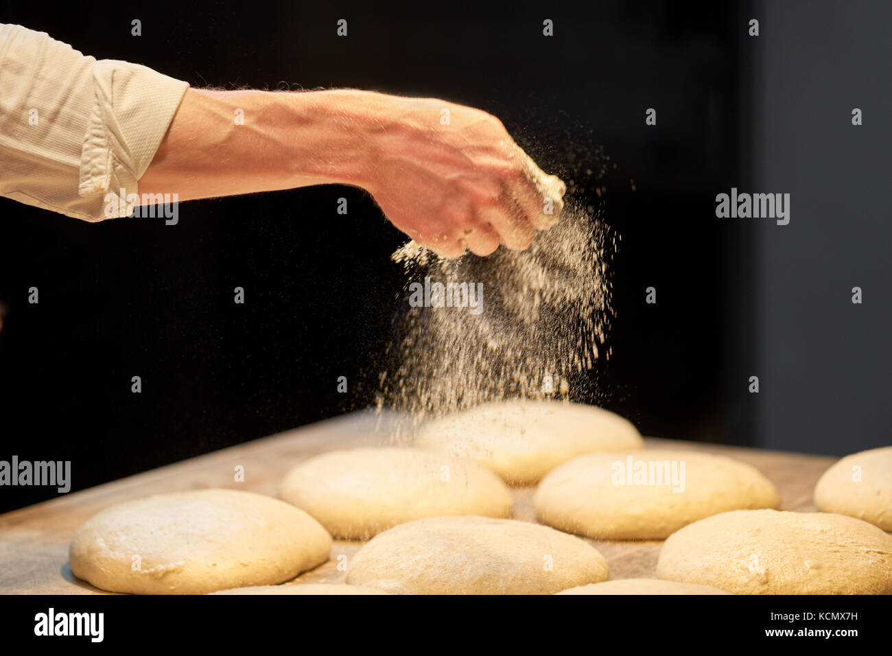 chef or baker making bread dough at bakery Stock Photo - Alamy