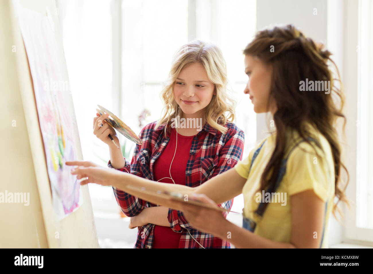 student girls or artists painting at art school Stock Photo - Alamy