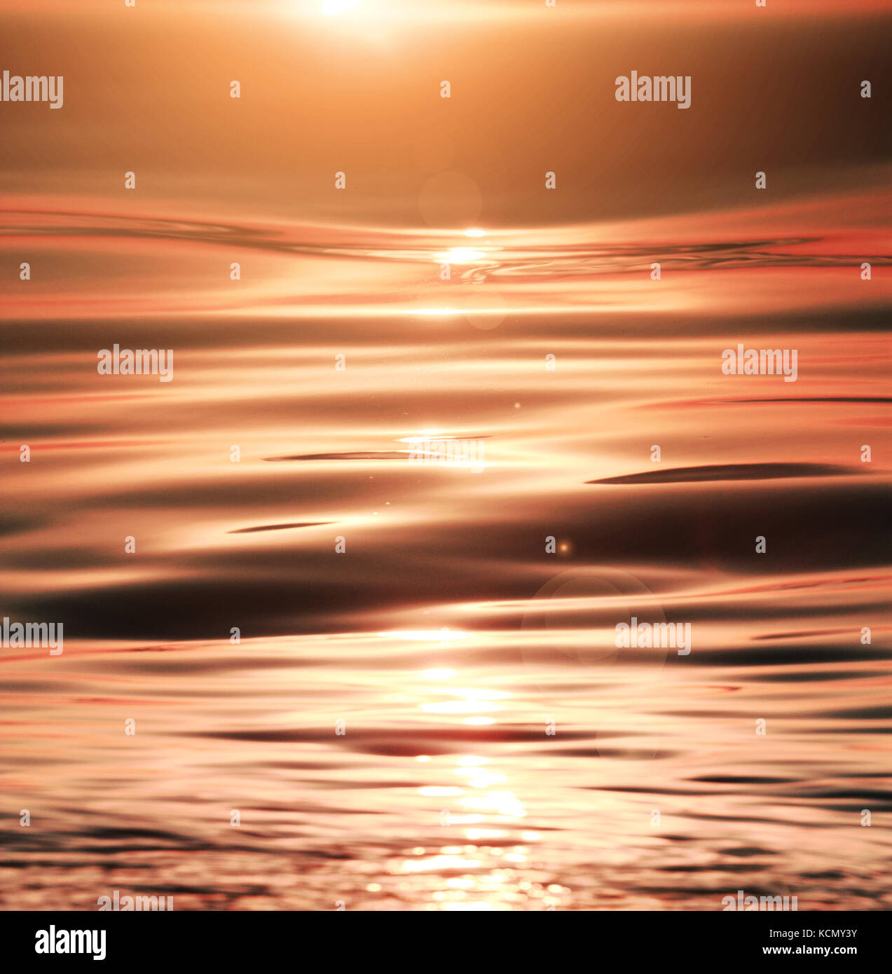 Sunshine sparkling sea waves at sunset beach Stock Photo - Alamy