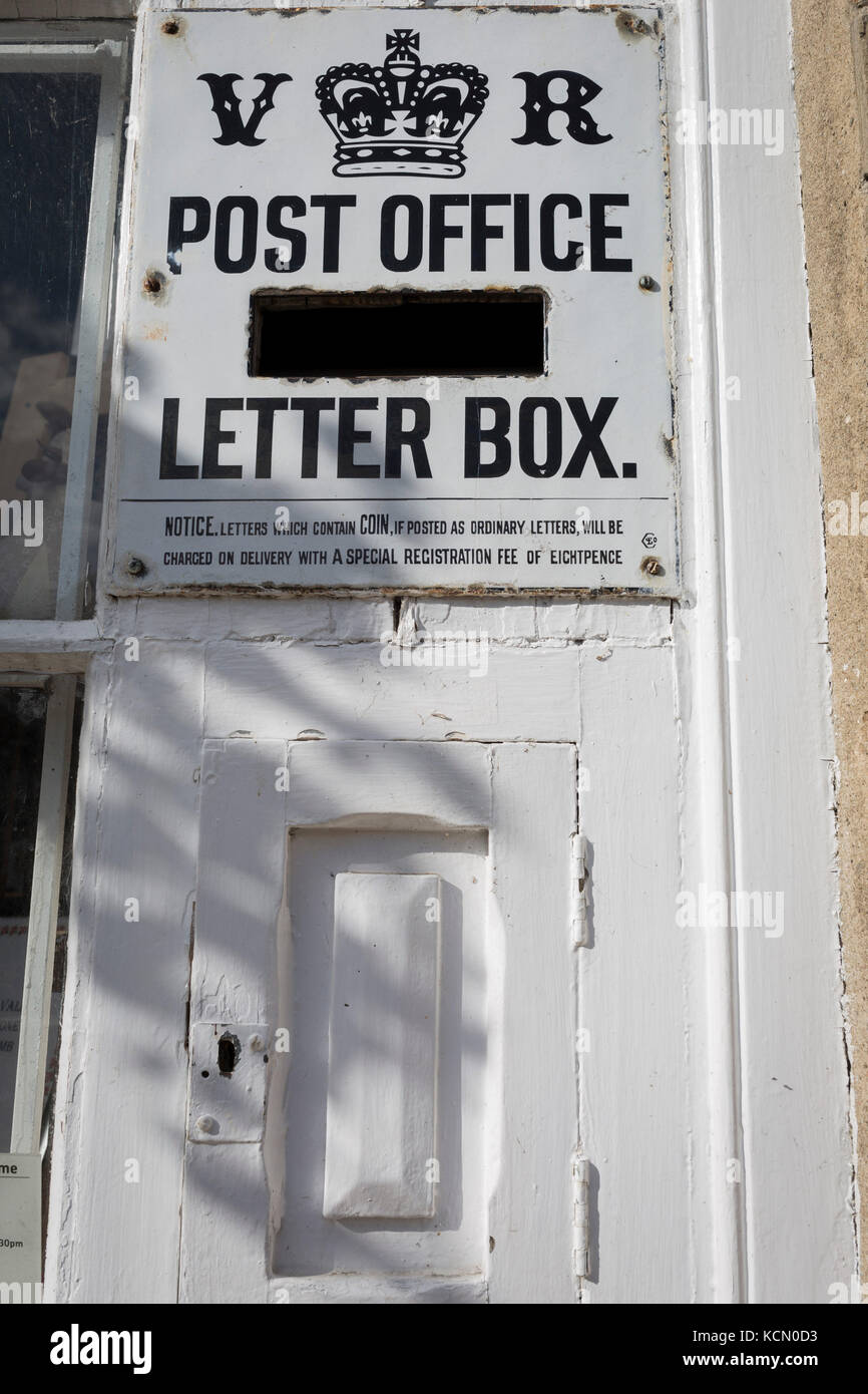 The Victorian letter posting box outside the local shop and post office ...