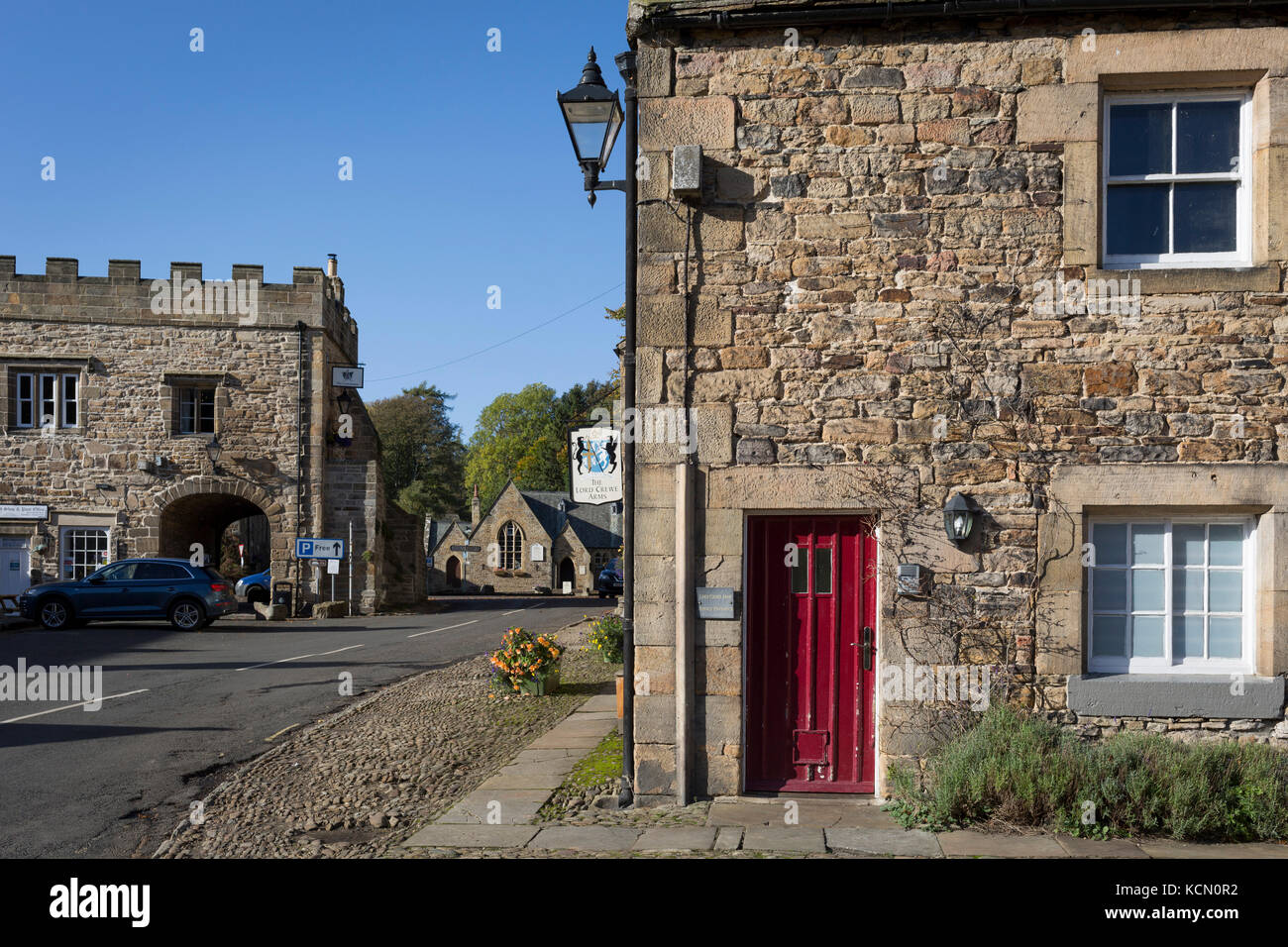 The A6306 road passing the Lord Crewe Arms Hotel in the Northumbrian ...