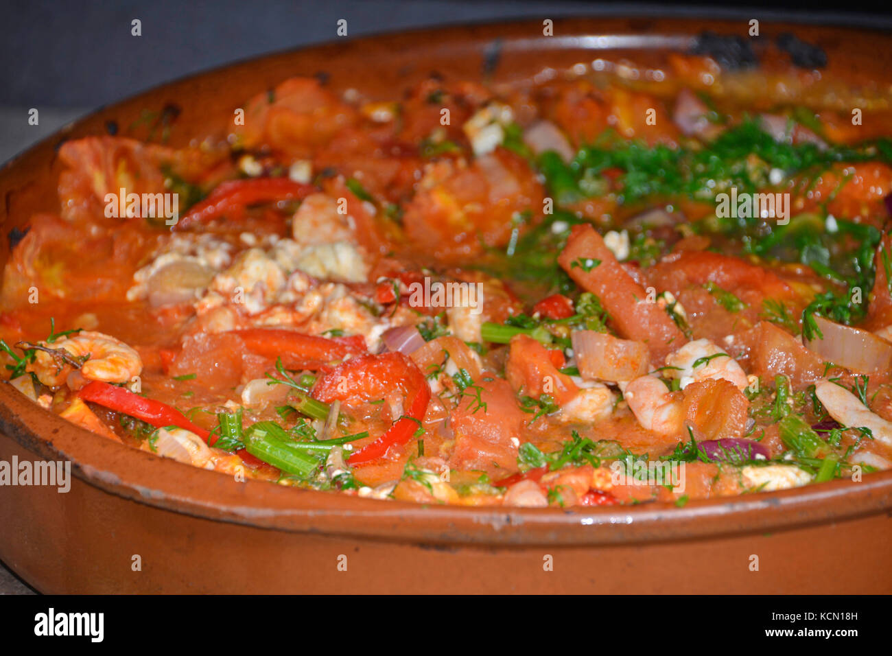 Delicious traditional greek dish garides saganaki Stock Photo - Alamy
