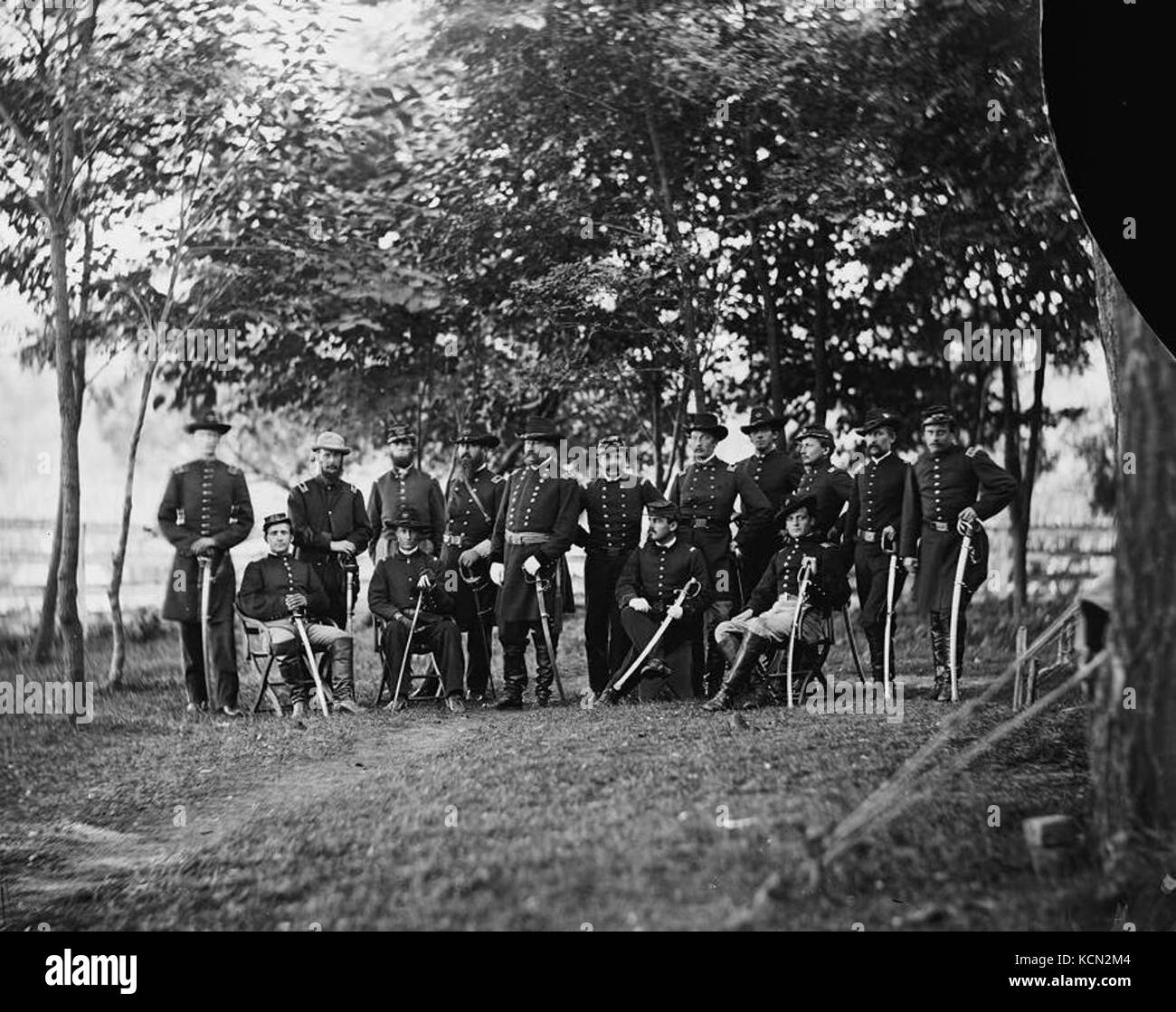 This image features a group of French soldiers and their staff, likely ...