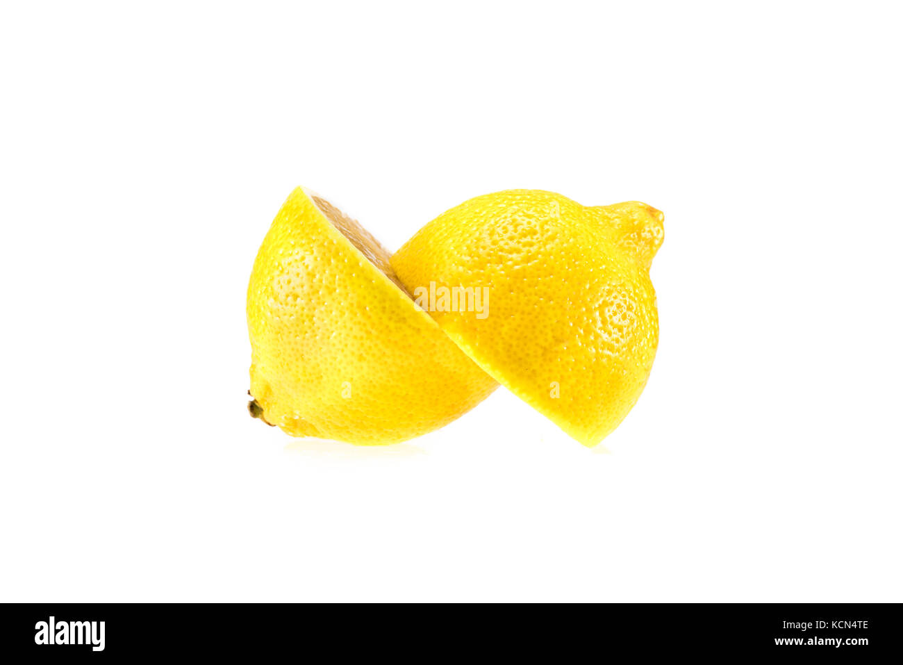 yellow halved lemon Stock Photo - Alamy