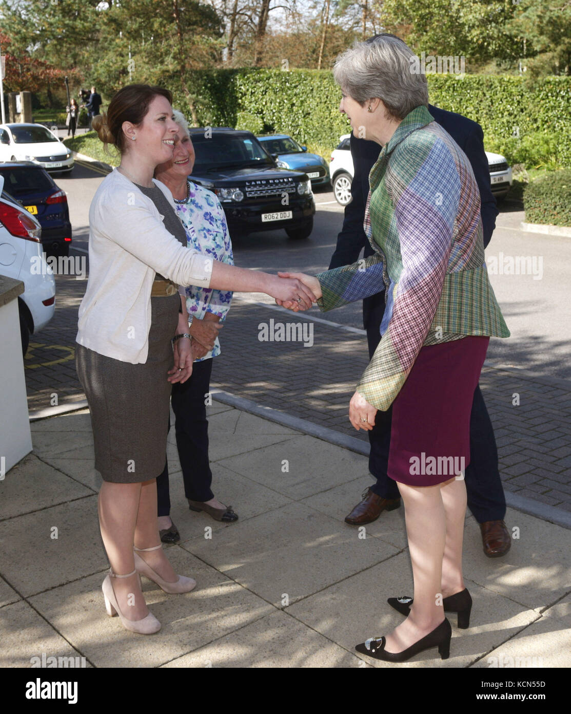 Prime Minister Theresa May (right) meets Clare Barbe (left) and Doreen ...