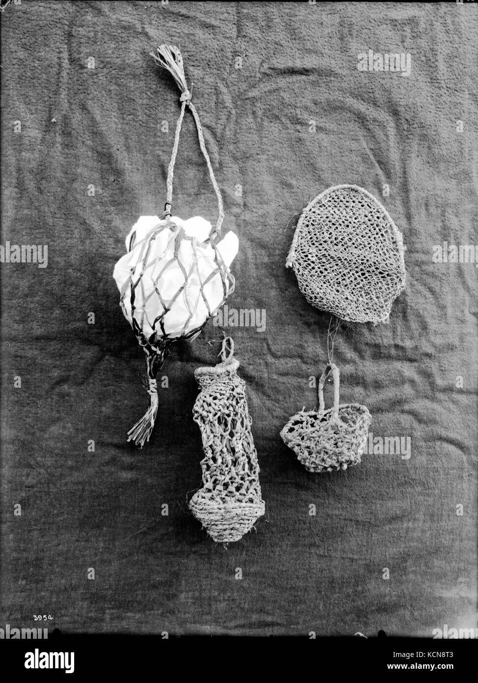 This display showcases four unidentified woven items from India, dating ...