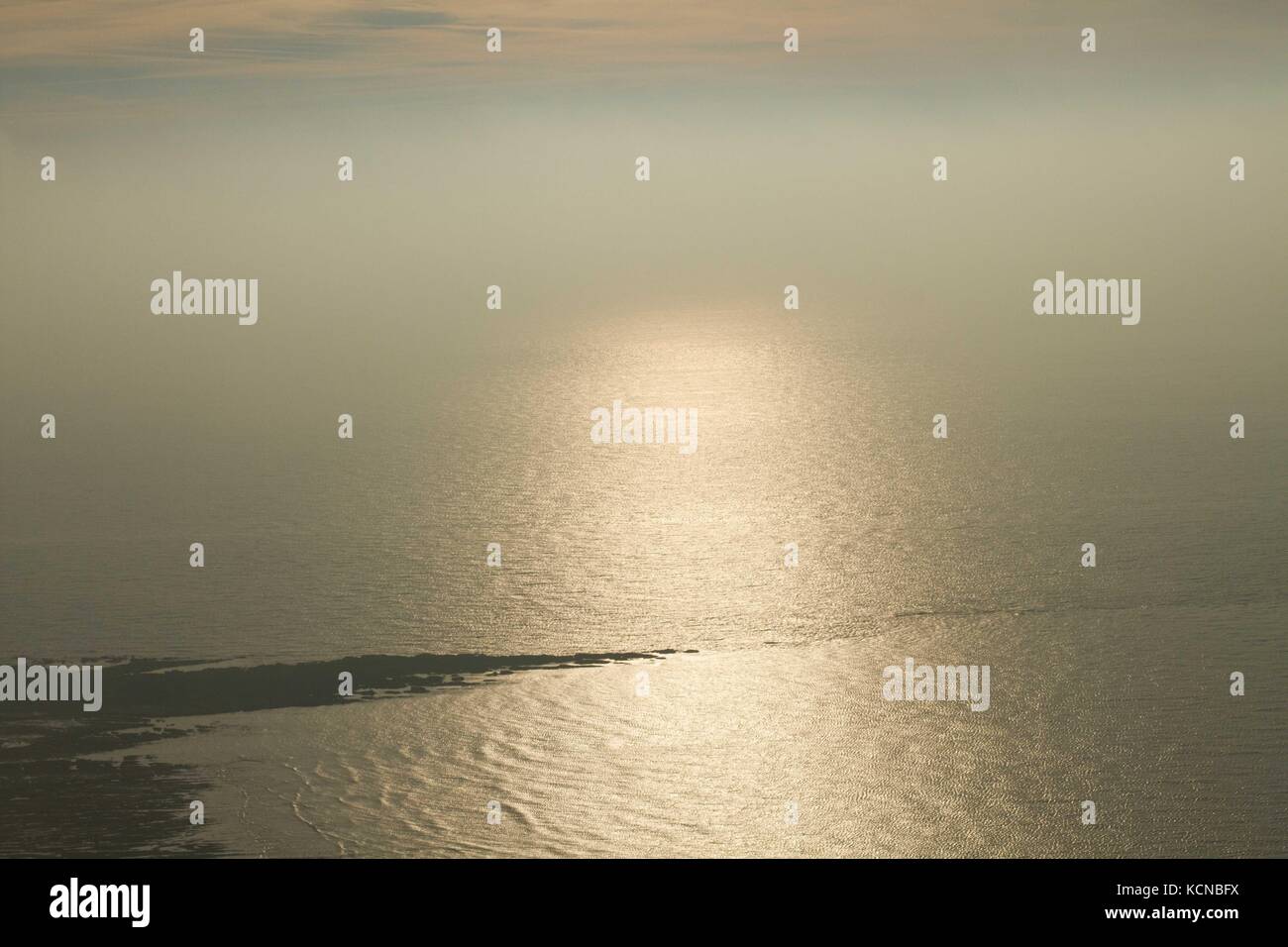 Beachy Head at sunrise in fog inversion with English channel swathed in ...