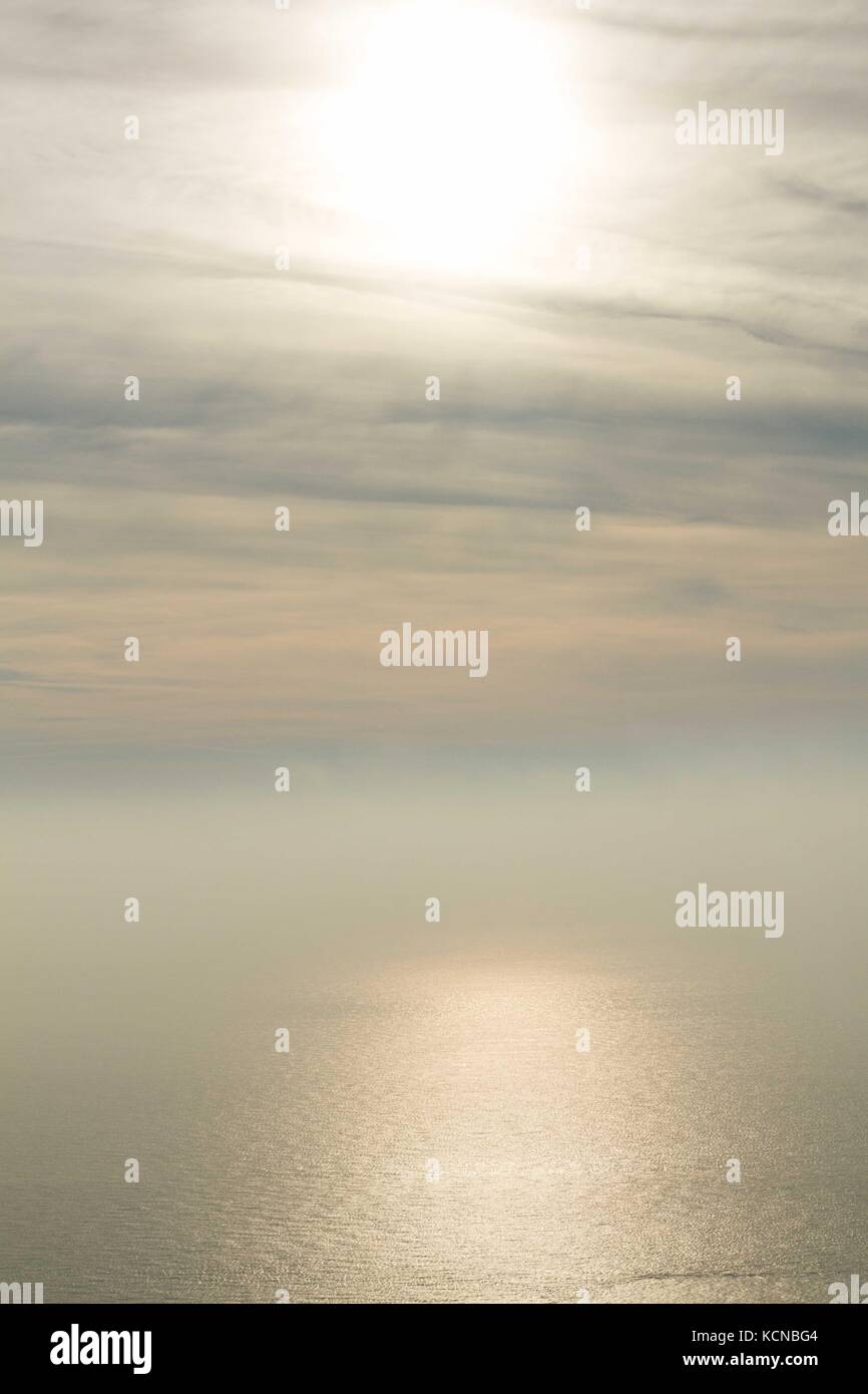 Beachy Head at sunrise in fog inversion with English channel swathed in ...