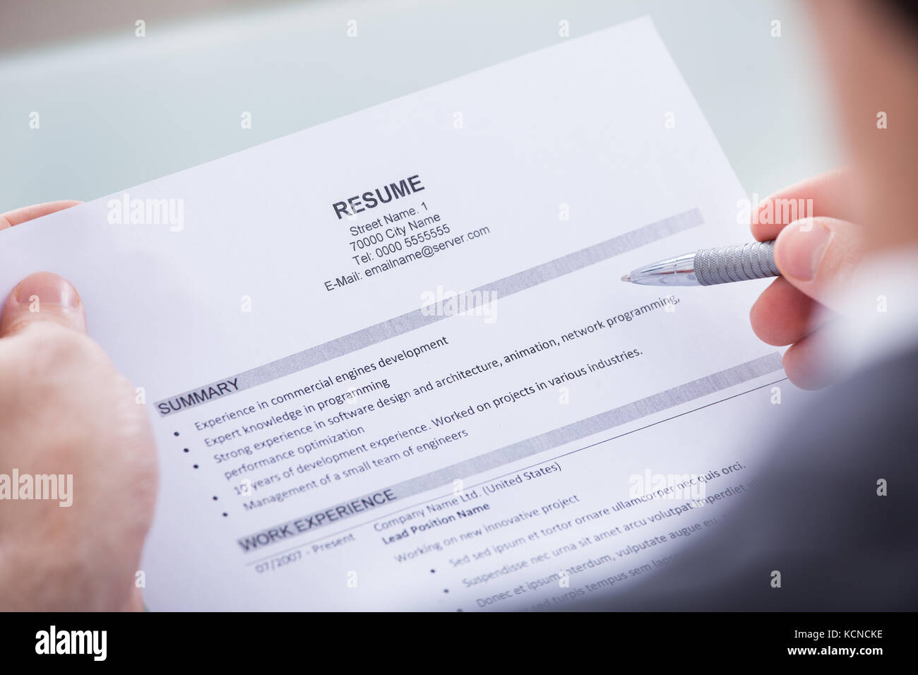 Close-up Of Photo Business Person Holding Resume Stock Photo - Alamy